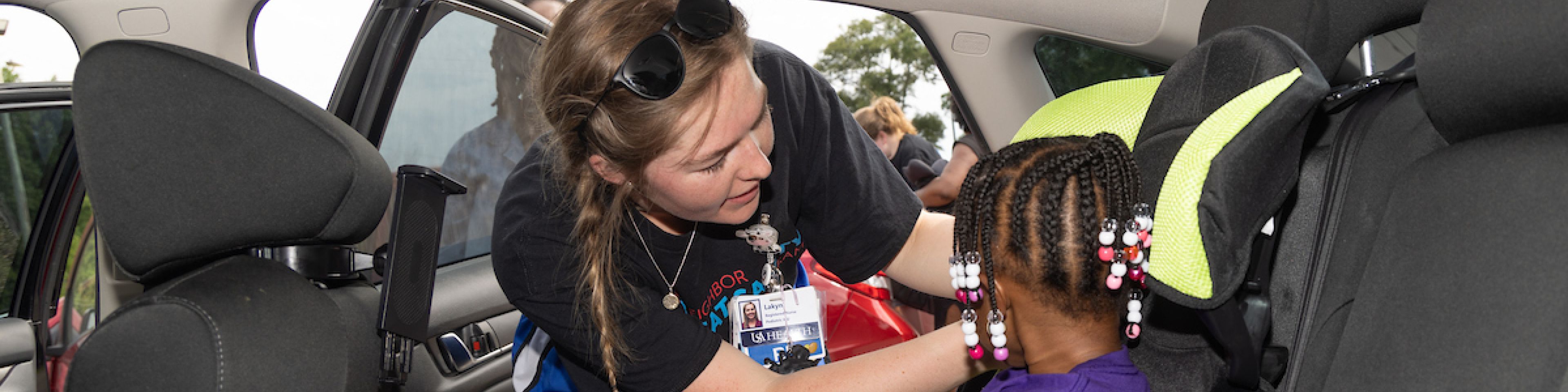 USA Health safety techs inspecting car seats at FOX 10 studios on Nov ...